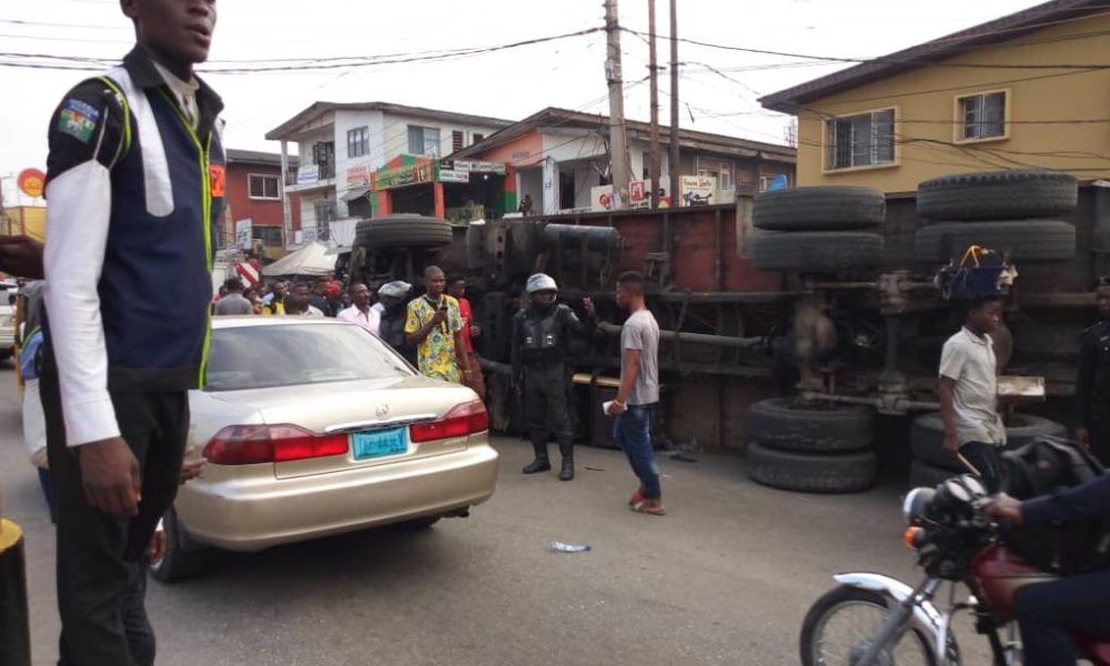 Trailer Laden With Container Falls Around Ikeja Under Bridge (Photos ...