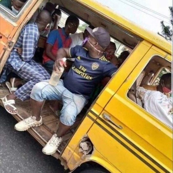 Lagos Bus Conductor Spotted With Hand Sanitizer And Face Mask (Photos ...